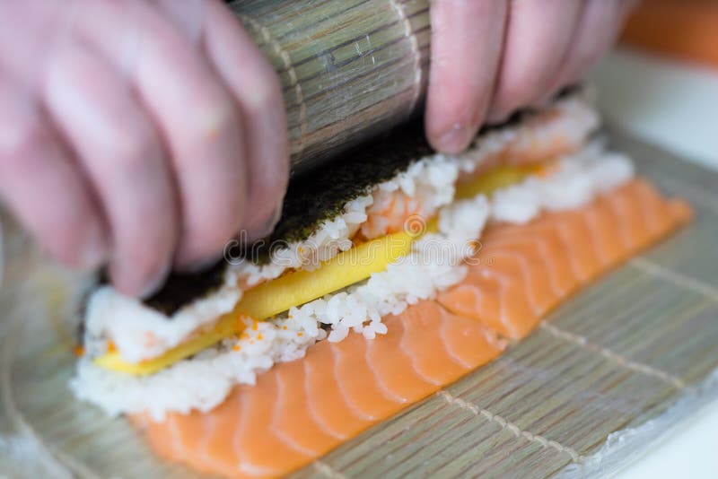 Sushi Master, Cutting Sushi Rolls. Making Sushi Rolls. Stock Photo ...