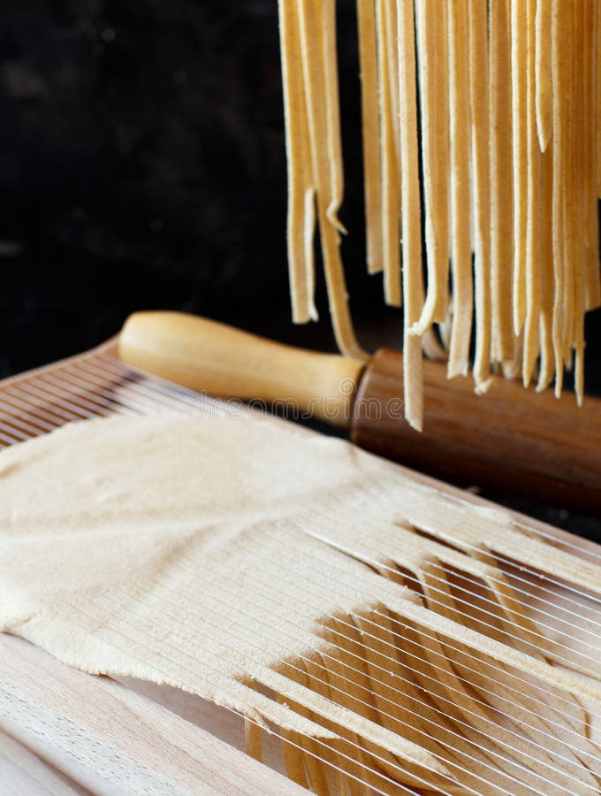Making Tagliolini Pasta Alla Chitarra with a Tool Stock Photo - Image ...