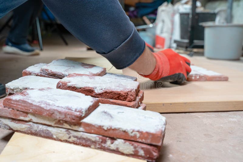 Making Tiles for Old Brick. Gloved Hands Carpenter Table Bricks Covered ...