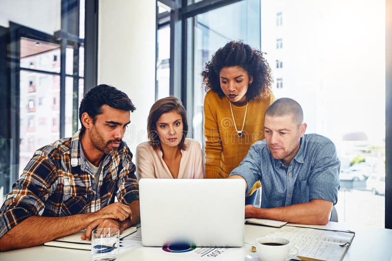 Making Updates To Their Latest Project. a Team of Designers Having a ...