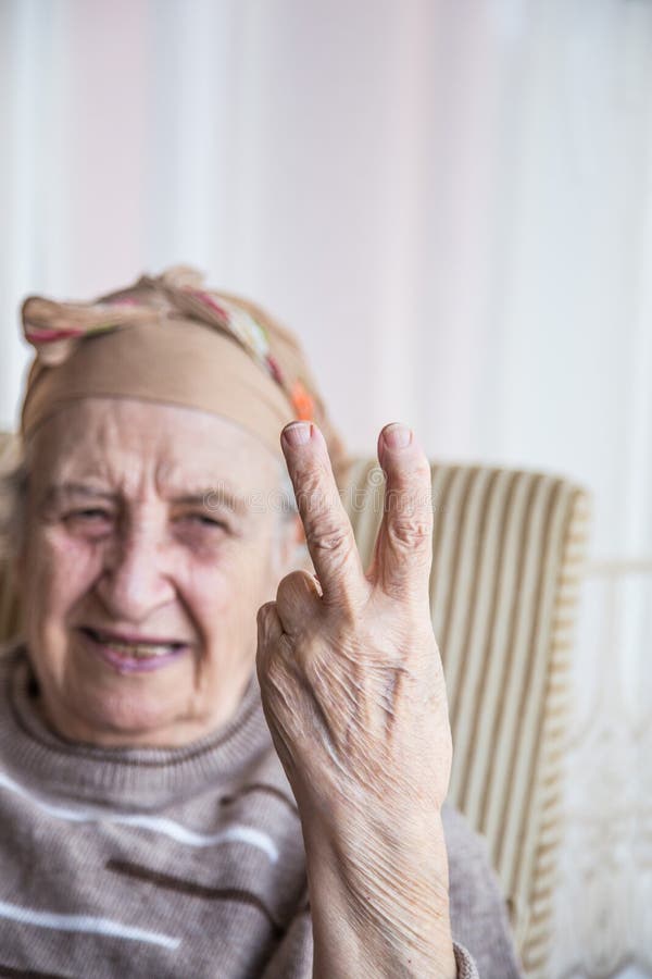 Making victory (V) sign stock photo. Image of face, people - 32552626