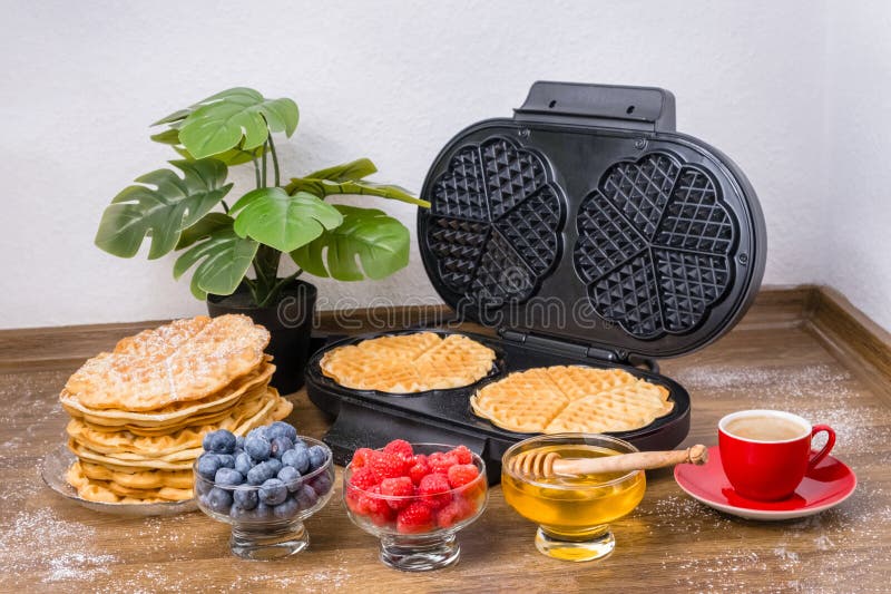Making Waffles at Home. Waffle Maker and Stack of Belgian Waffles with ...