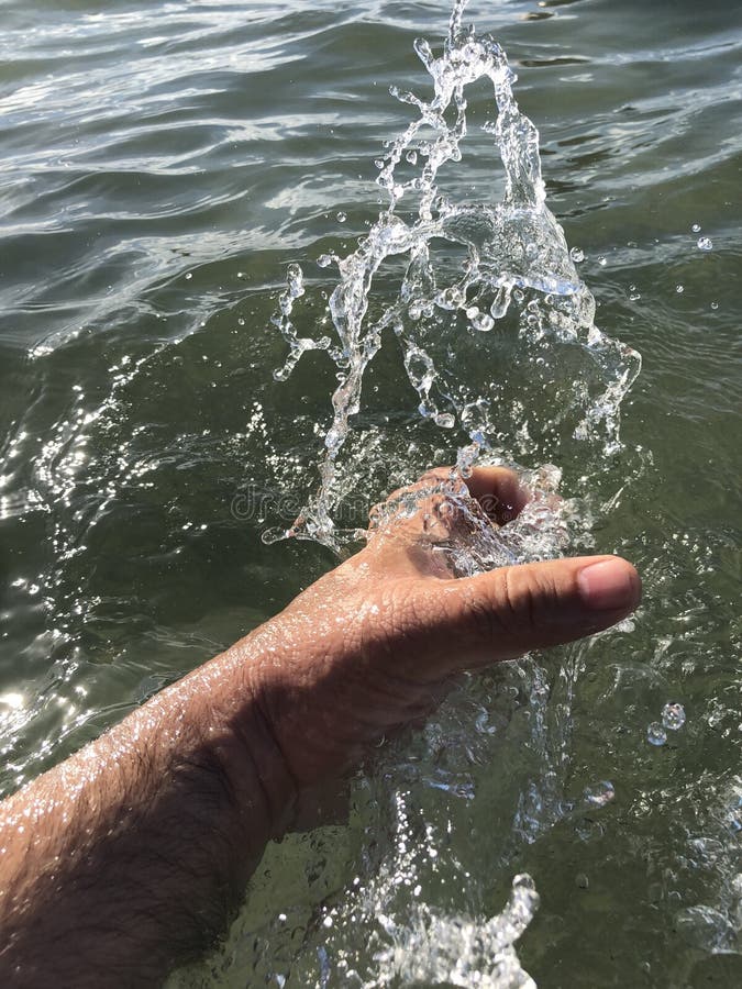Catching water drops stock photo. Image of beach, making - 110745398