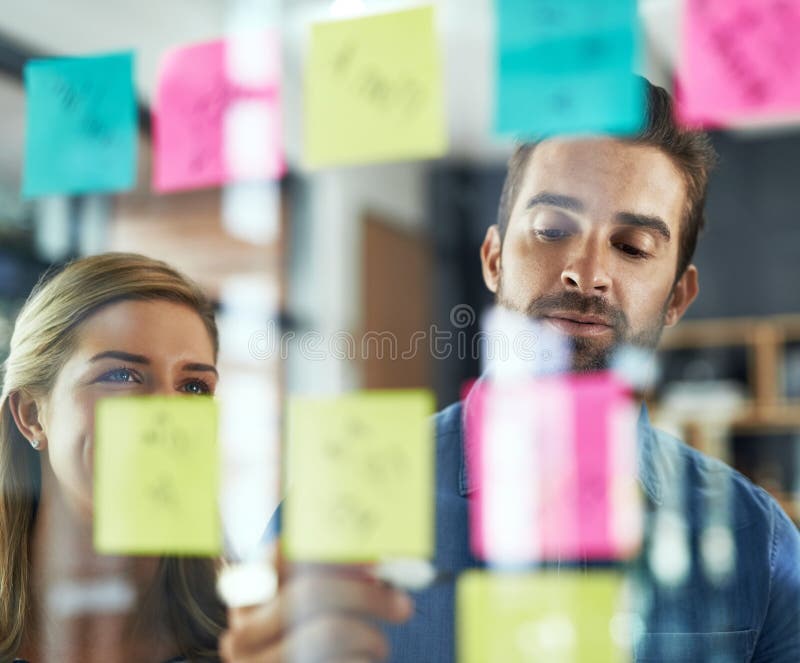 The Makings of a Great Marketing Strategy. Two Colleagues Having a ...