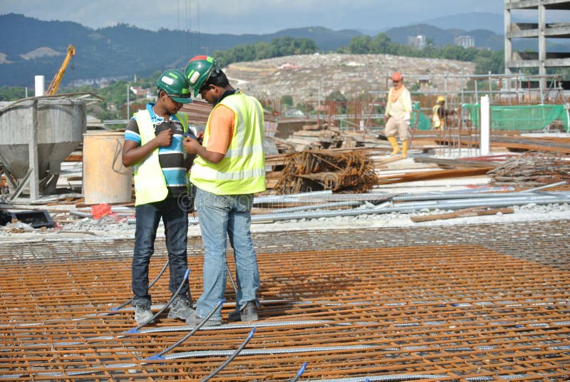 Construction Workers Having a Discussion at the Construction Site ...