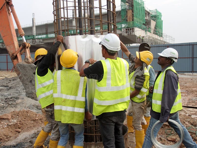 Construction Workers Having a Discussion at the Construction Site ...