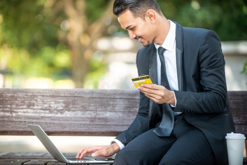 Malay Businessman Doing Online Purchase during His Coffee Break ...