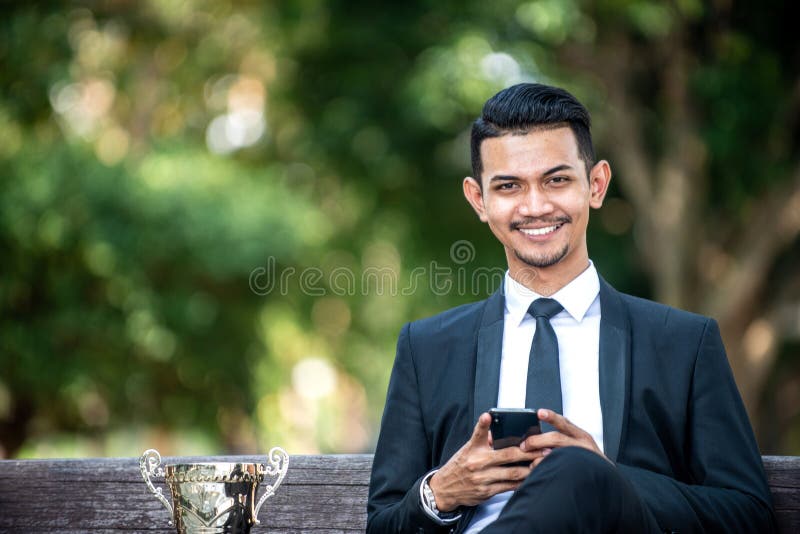 Malay Businessman Wins a Trophy. Stock Image - Image of male, business ...