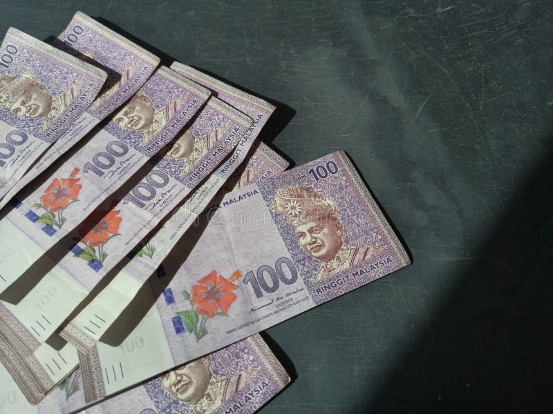 There is a Hundred Ringgit Malaysia Scattered on the Table. Stock Image ...