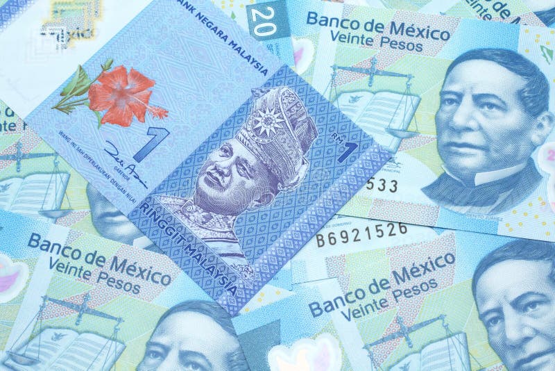 A Malaysian Ringgit on a Background of Mexican Twenty Peso Bank Notes ...