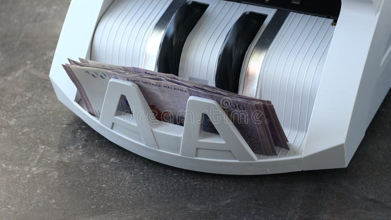 Malaysian Ringgit. Counting Malaysian Money in Banknote Counting ...