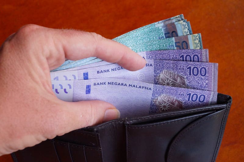 Malaysian Ringgit in the Wallet. Stock Photo - Image of hand, banknote ...