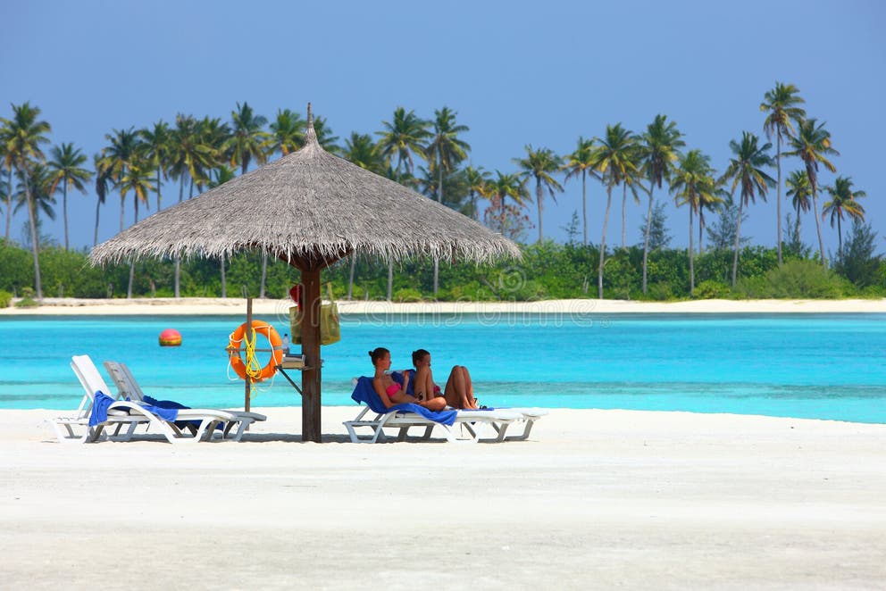 Maldives beach sunbathe editorial photography. Image of island - 38084562