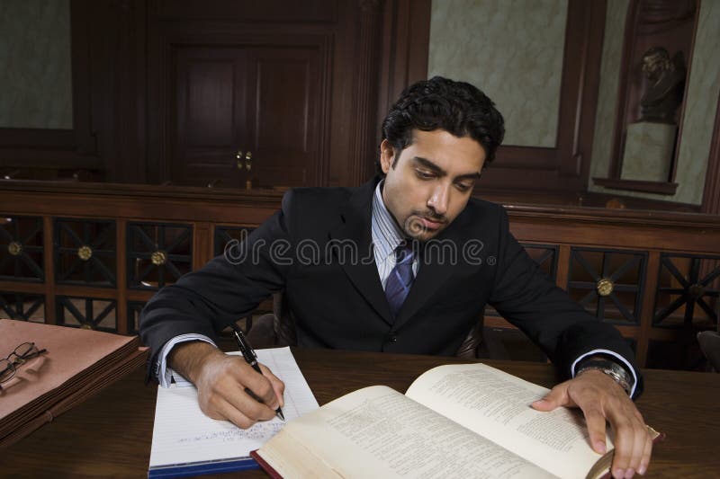 Male Advocate Reading Law Book Stock Photo - Image of people, courtroom ...