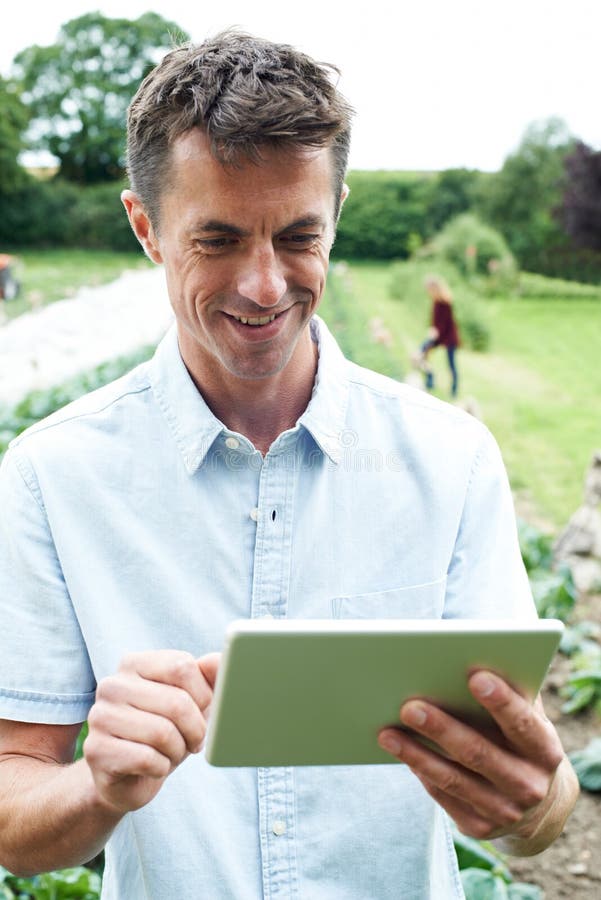 Male Agricultural Worker Using Digital Tablet in Field Stock Image ...