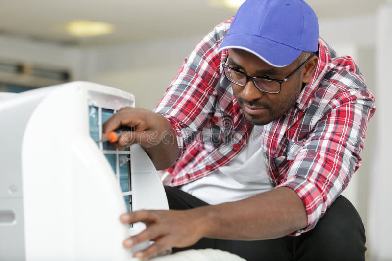 Male Air Conditioning Technician Stock Image - Image of hands ...