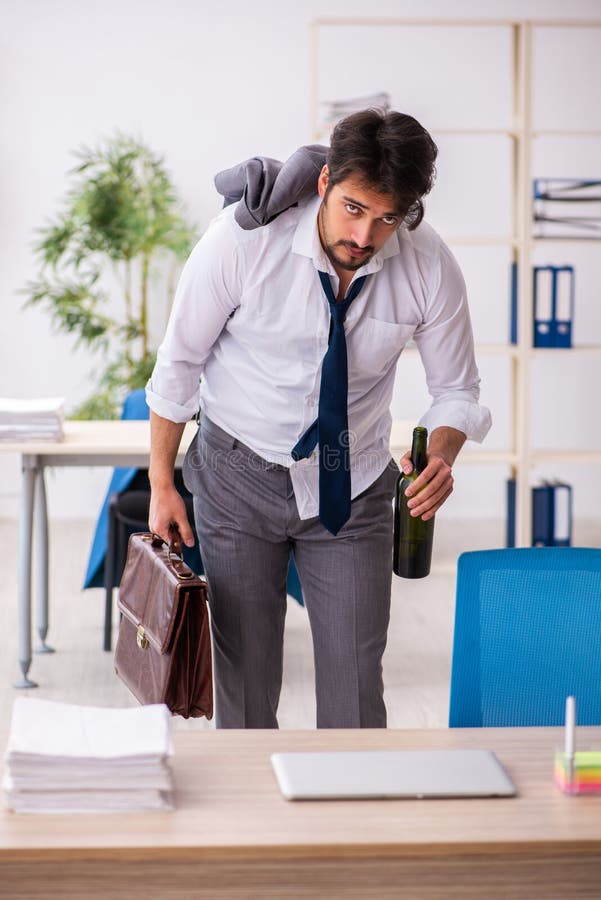 Young Alcohol Addicted Employee Sitting in the Office Stock Image ...