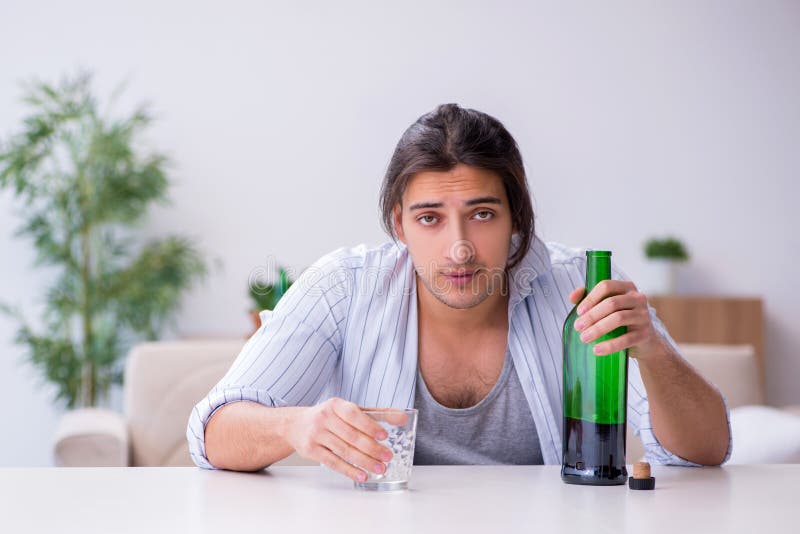 Young Male Alcoholic Drinking Whiskey at Home Stock Image - Image of ...