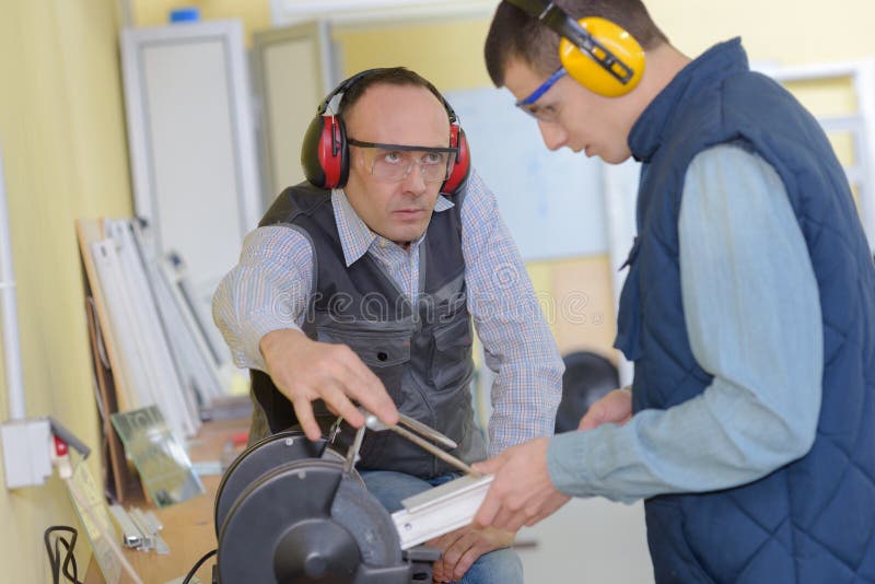 Male Apprentice Carpenter Learning Trade Stock Image - Image of ...