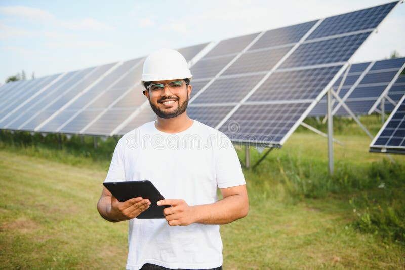 Male Arab Engineer Standing on Field with Rows of Solar Panels Stock ...