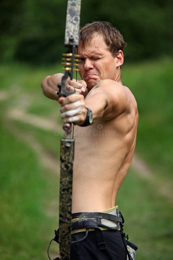 Male Archer Aiming at Target Stock Image - Image of male, direction ...