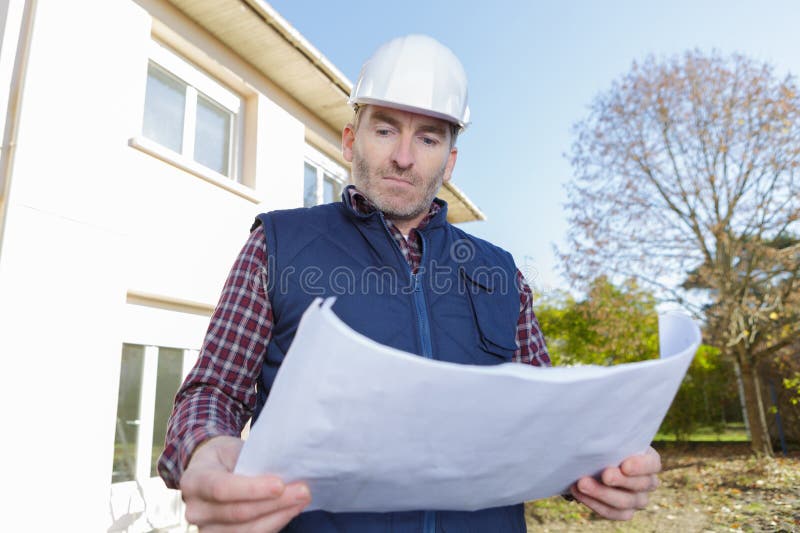 Male Architect with Blueprint Outside Site Stock Image - Image of ...