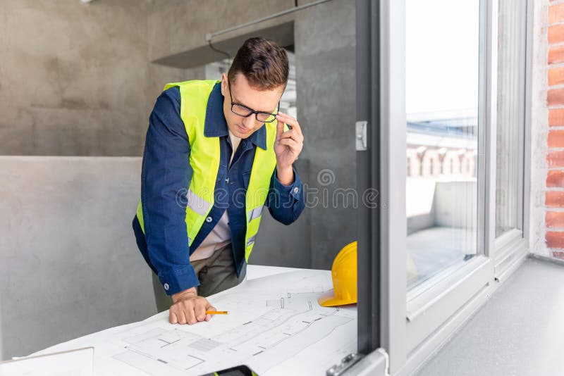 Male Architect with Blueprint Working at Office Stock Image - Image of ... Male Architect with Blueprint Working at Office Stock Image - Image of ...