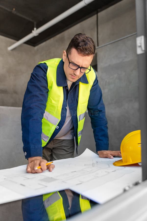 Male Architect with Blueprint Working at Office Stock Photo - Image of ...