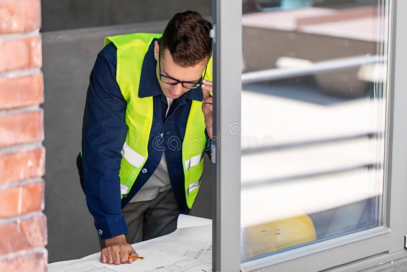 Male Architect with Blueprint Working at Office Stock Image - Image of ...
