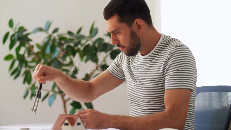 Male Architect with Blueprint Works at Home Office Stock Footage ...