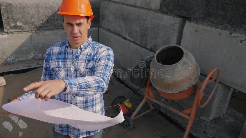 Male Architect Builds a Foundation of Cement. Concept Building ...
