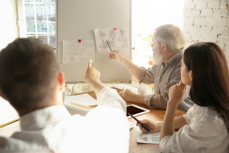 Male Architect-engineer Presents Project of Future House for Young ...