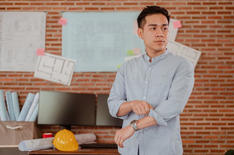 Male Architect in Formalwear Bending Working Engineering with ...