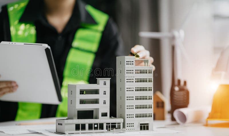 Male Architect Hands Making Model House. Man Architect Working in the ... Male Architect Hands Making Model House. Man Architect Working in the ...