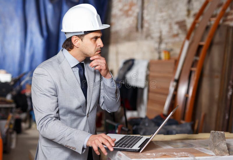 Male Architect Holding Laptop Stock Image - Image of facing, designer ... Male Architect Holding Laptop Stock Image - Image of facing, designer ...