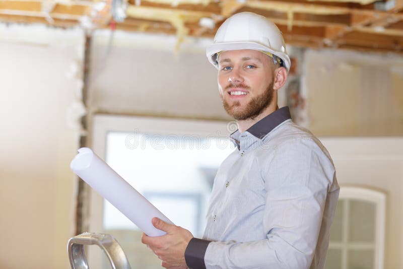 Male Architect Inside Residential Property Under Renovation Stock Photo ...