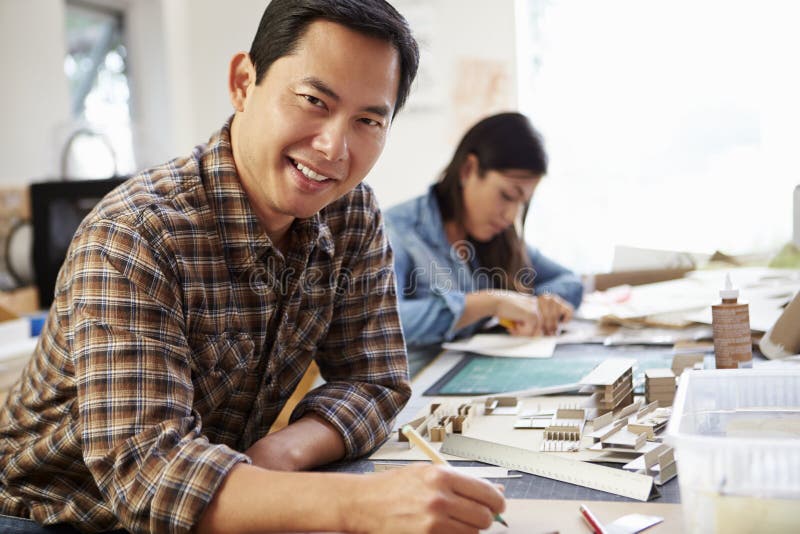 Male Architect with Digital Tablet Studying Plans in Office Stock Photo ... Male Architect with Digital Tablet Studying Plans in Office Stock Photo ...
