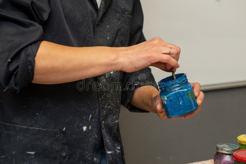 Male Artist Mixing Blue Paint in Studio Setting Stock Photo - Image of ...