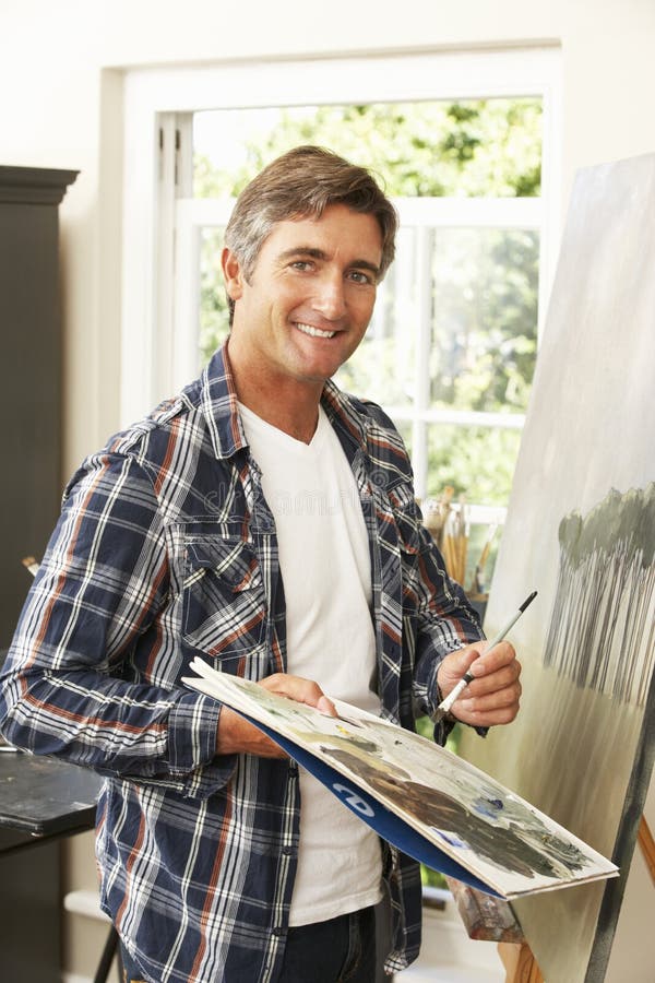 Male Artist Working on Painting in Studio Stock Photo - Image of brush ...