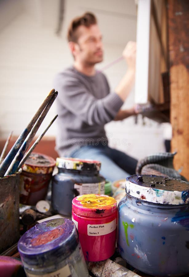 Portrait of Male Artist Working on Painting in Studio Stock Image ...