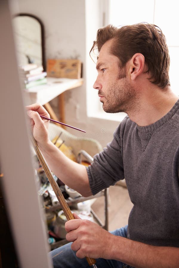 Male Artist Working on Painting in Studio Stock Photo - Image of ...