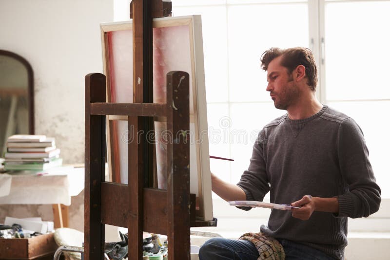 Male Artist Working on Painting in Studio Stock Image - Image of ...