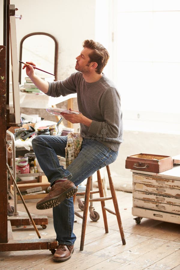Portrait of Male Artist Working on Painting in Studio Stock Image ...