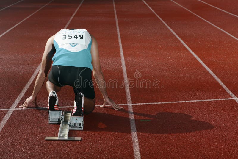 Male Athlete Crouching on Starting Line Stock Photo - Image of focus ...