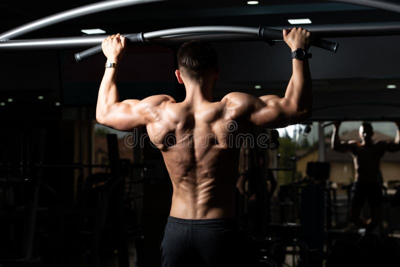 Male Athlete Doing Pull Ups Stock Photo - Image of chest, posing: 141343274