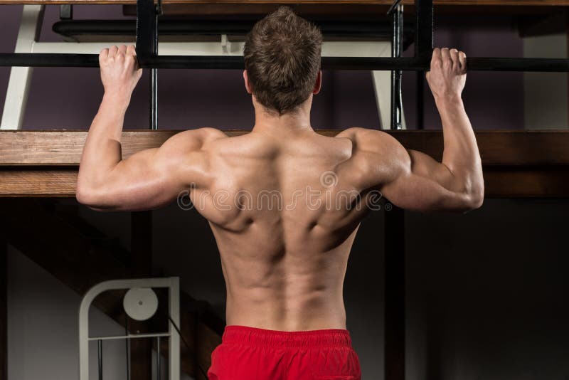 Male Athlete Doing Pull Ups Stock Image - Image of lighting, athlete ...