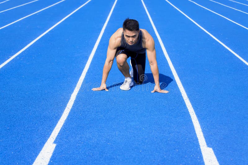 Male Athlete on Race Track is Ready To Run Stock Image - Image of ...