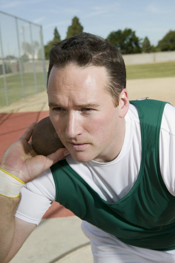 Male Athlete Ready To Throw Shot Put Stock Photo - Image of person ...