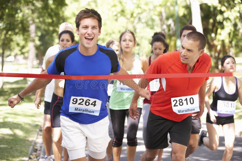 Male Athlete Winning Marathon Race Stock Photo - Image of group, race ...