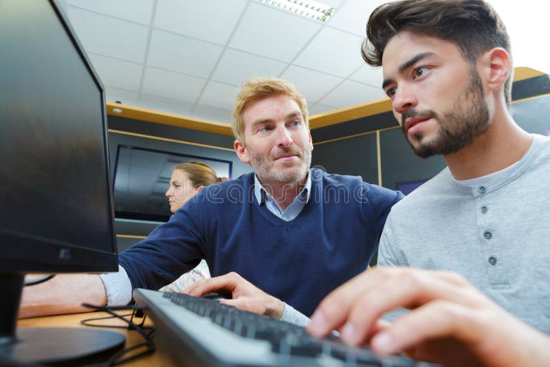 Male Automobile Looking at Computers Stock Image - Image of technology ...